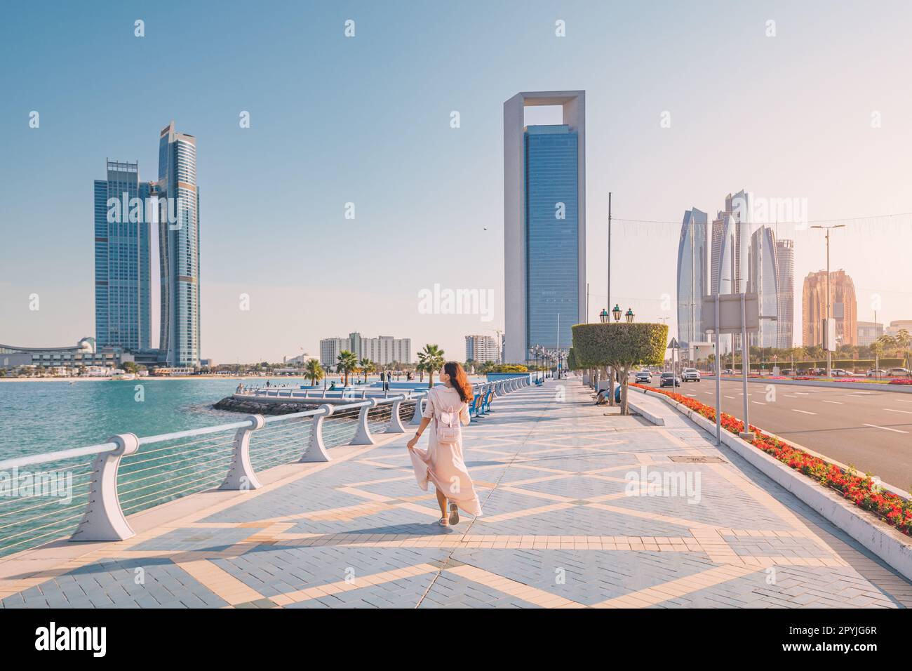 Strolling along the Abu Dhabi Corniche, a scenic waterfront promenade with stunning views of the ...
