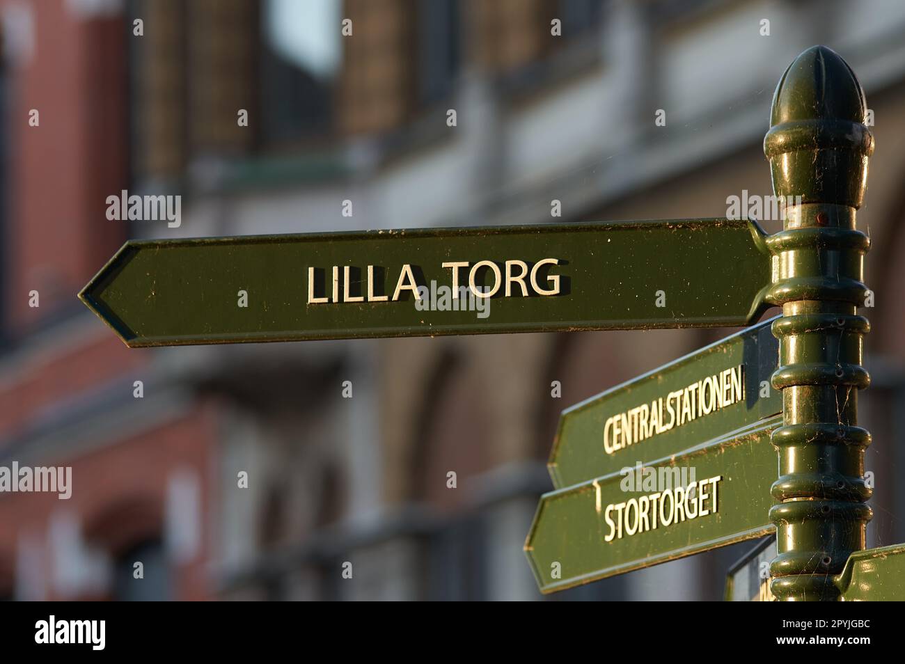 A pole with signs in the city of Malmo, Sweden, that shows directions ...