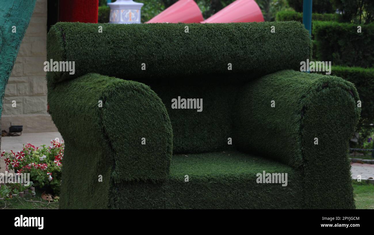 artificial grass sofa in a garden Stock Photo - Alamy