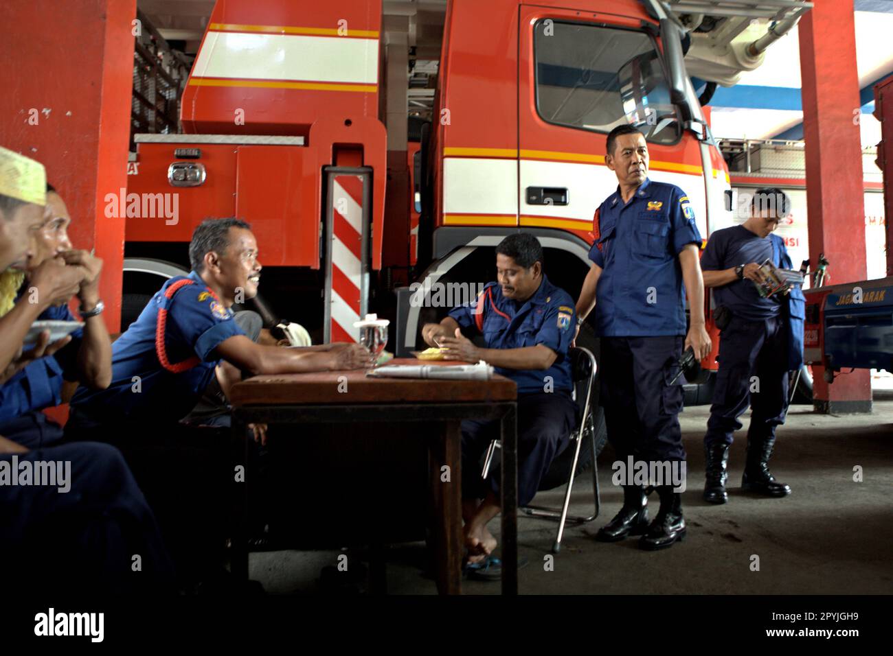 Firefighters having a relax time at their station in Petojo, Central ...