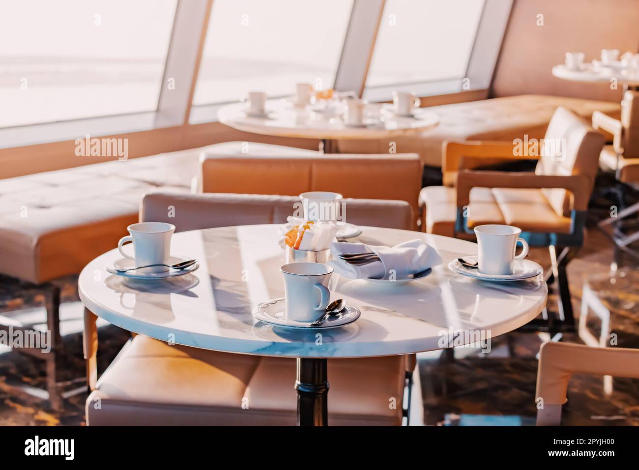 Rooftop aerial viewpoint cafe empty tables with cups in skyscraper ...