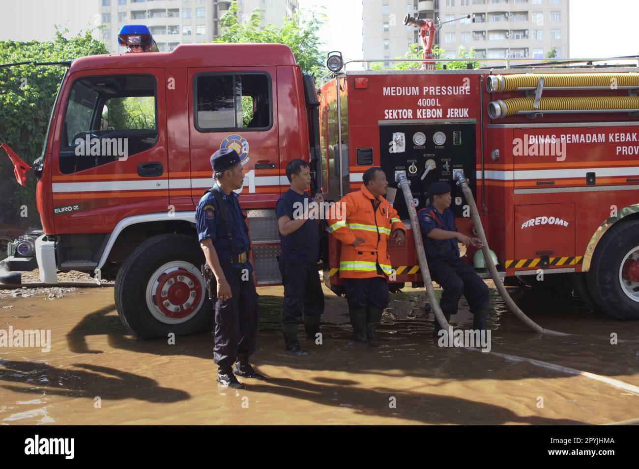 Members of Jakarta firefighting squad having a conversation on the side ...