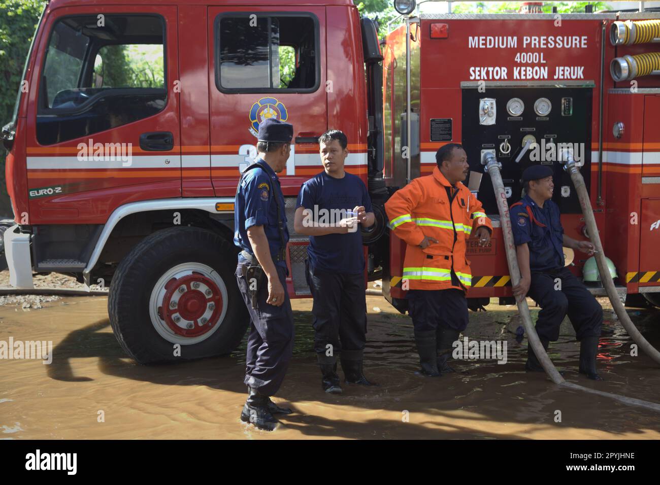 Members of Jakarta firefighting squad having a conversation on the side ...
