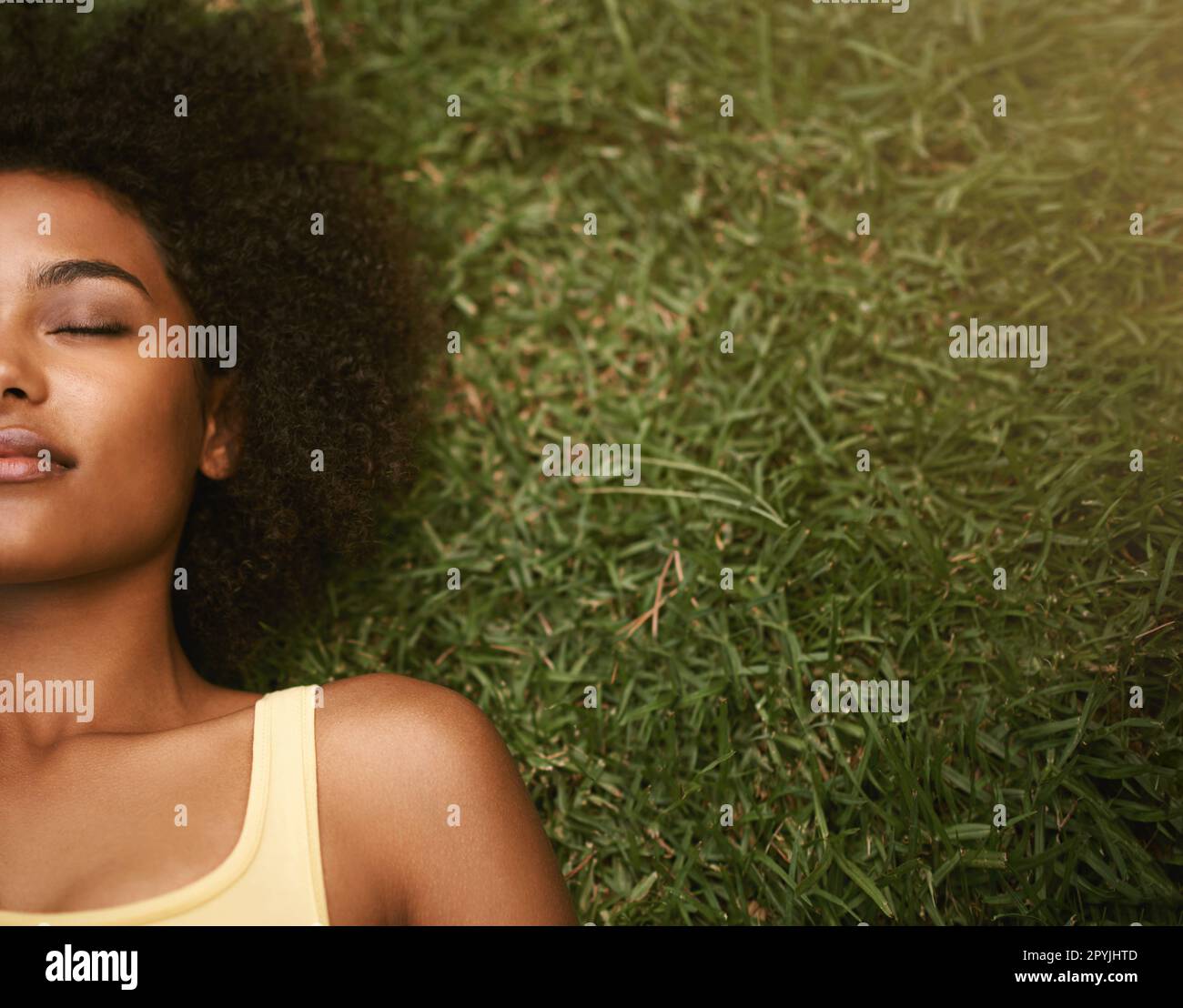 Sleep, grass and mockup with a black woman lying on a field from above ...