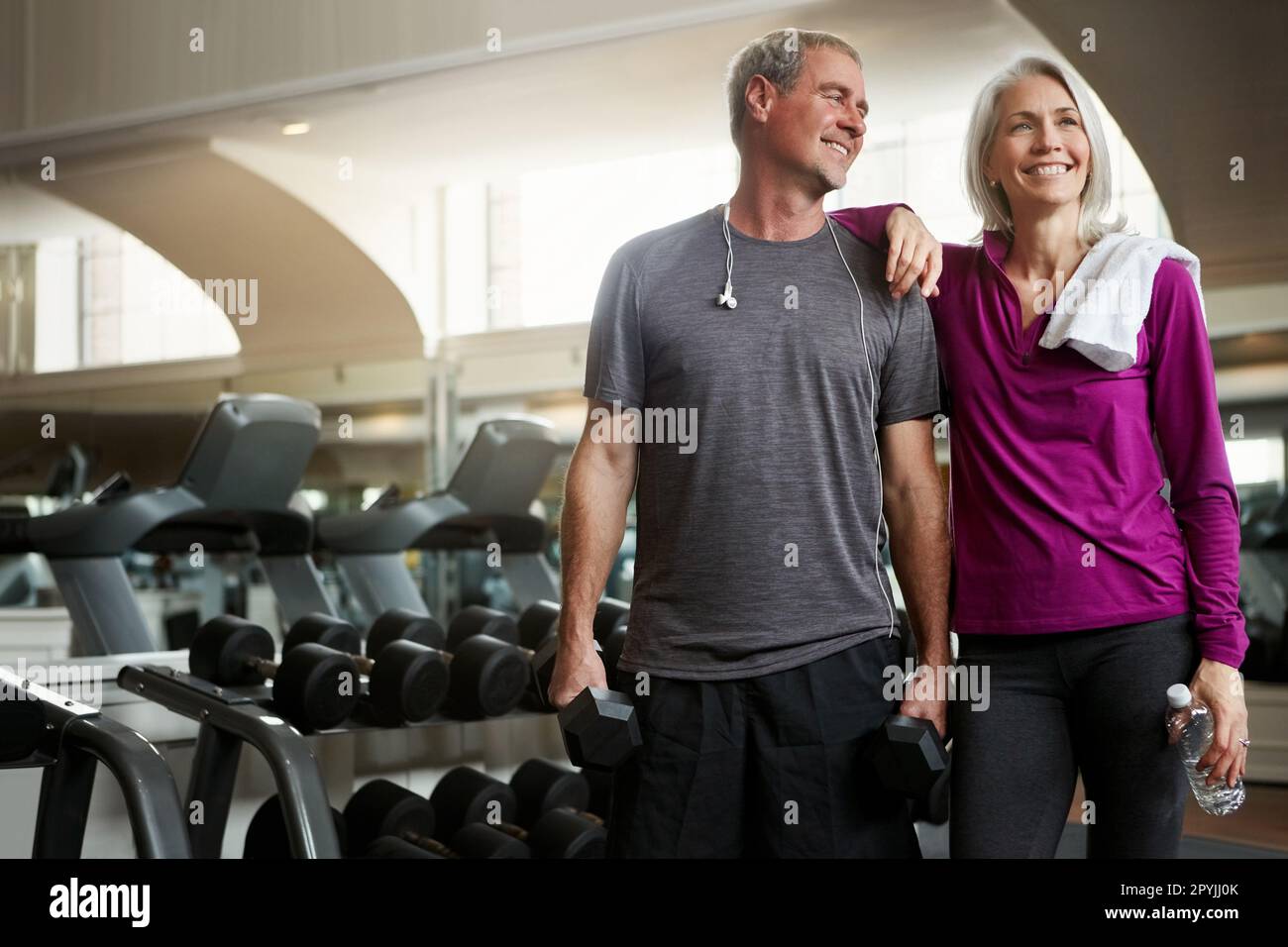 Laughing is a great exercise. a senior married couple laughing and ...