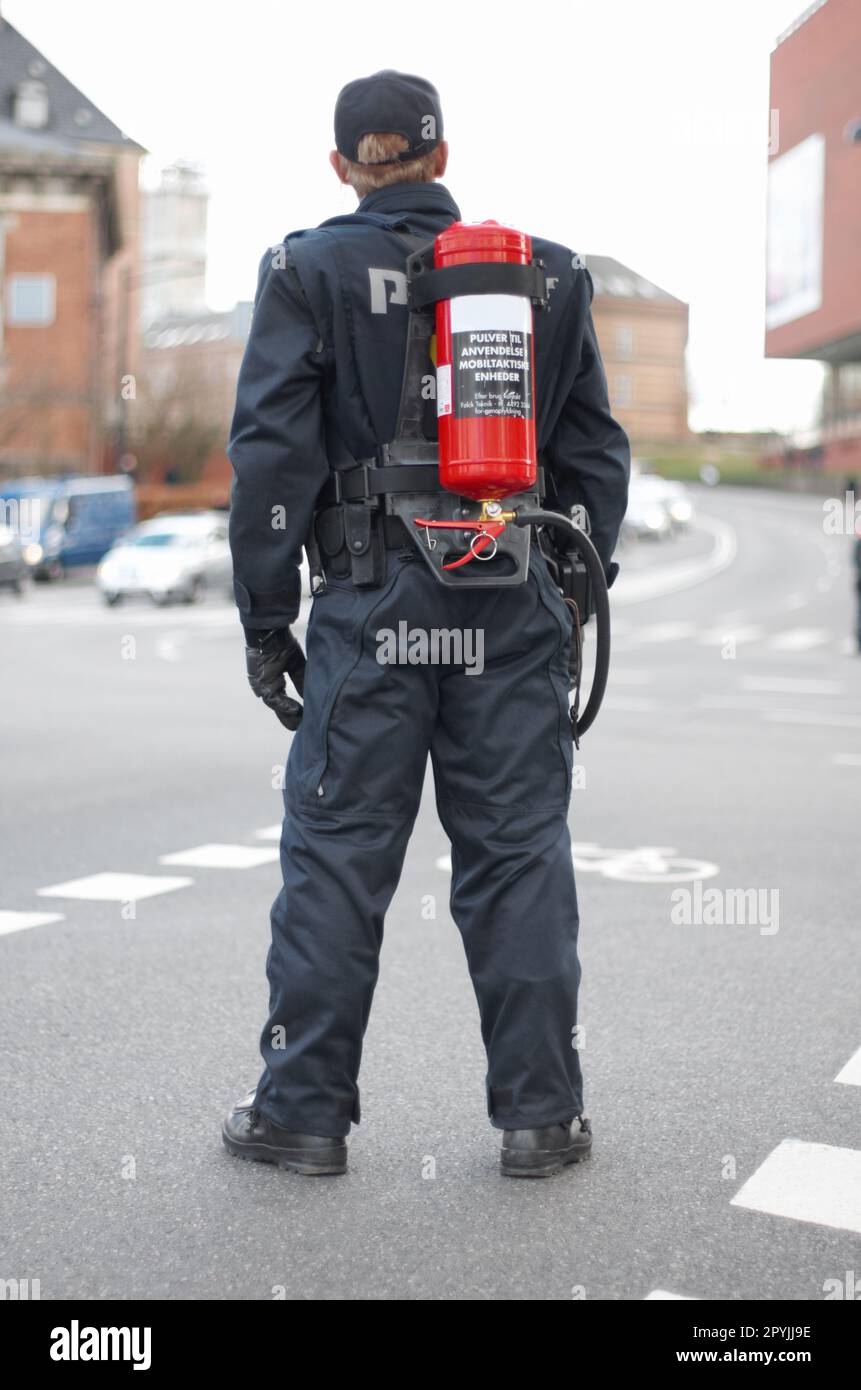 Emergency, police and man safety officer or fireman working a ...