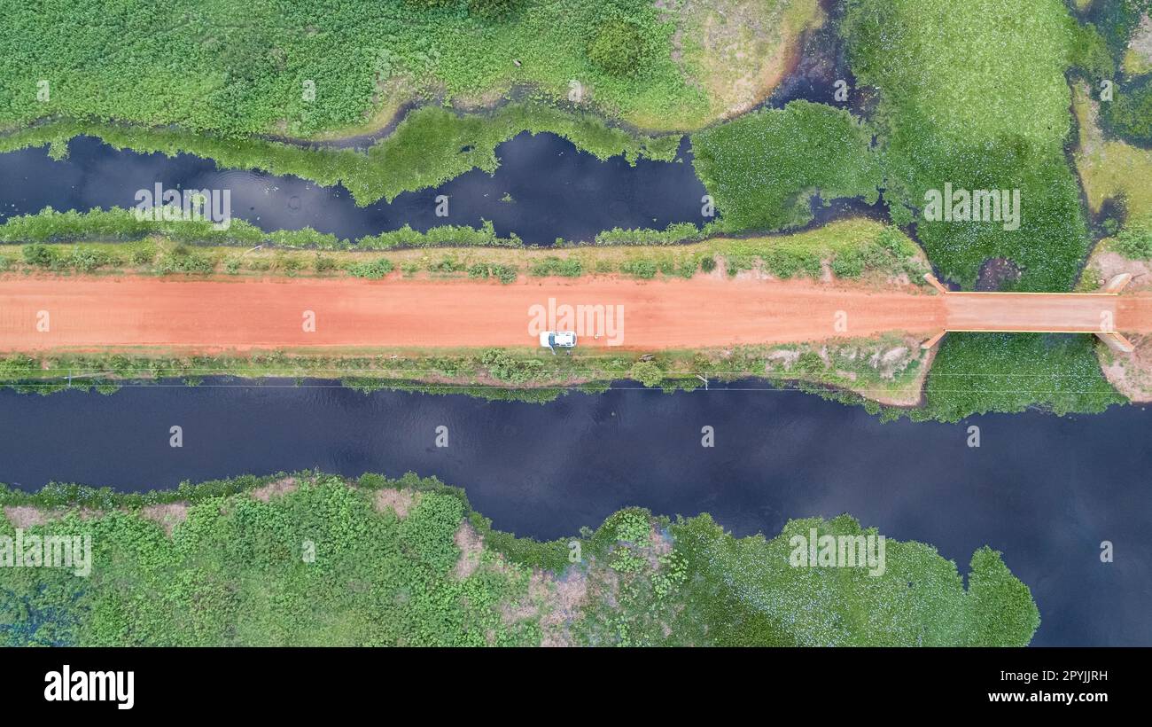Aerial view vertical down of Transpantaneira dirt road with a car and ...