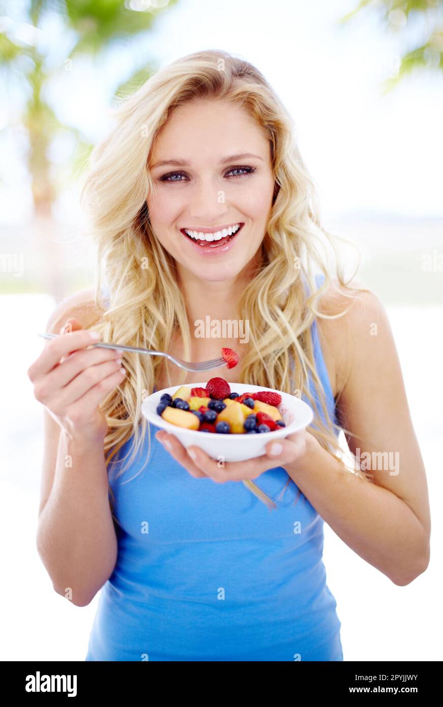 Woman, portrait smile and fruit bowl for healthy eating, nutrition or ...