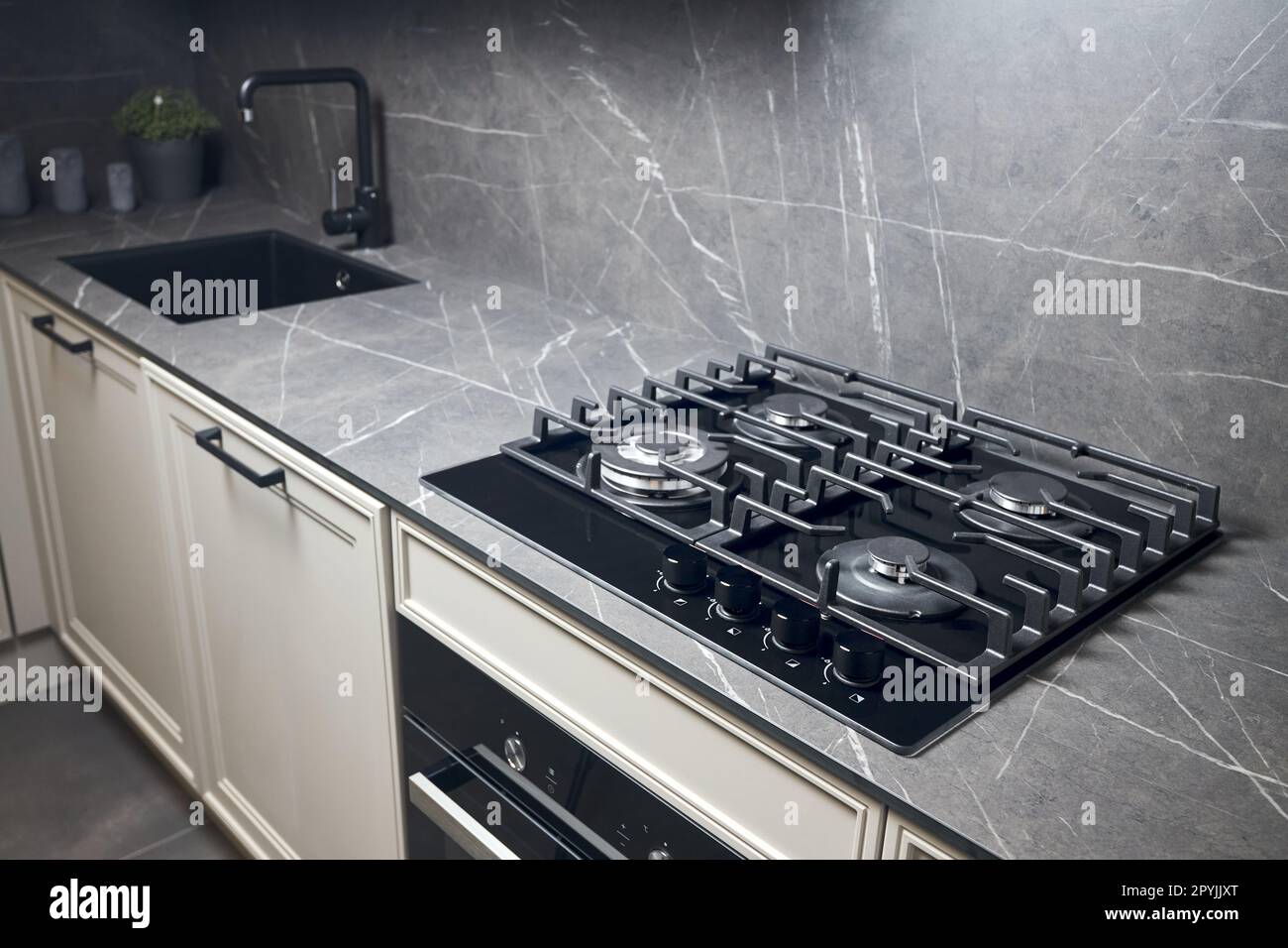 Contemporary black tempered glass gas stove hob with four burners with ...