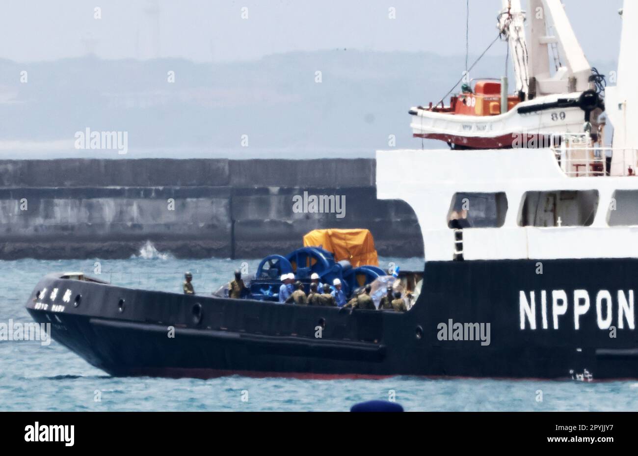 Members of the Japan Ground Self-Defense Force (JGSDF) inspect the ...
