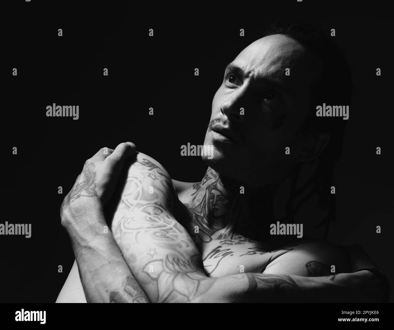 Brutal angry gang man lifestyle, serious handsome guy. Shadow male face ...