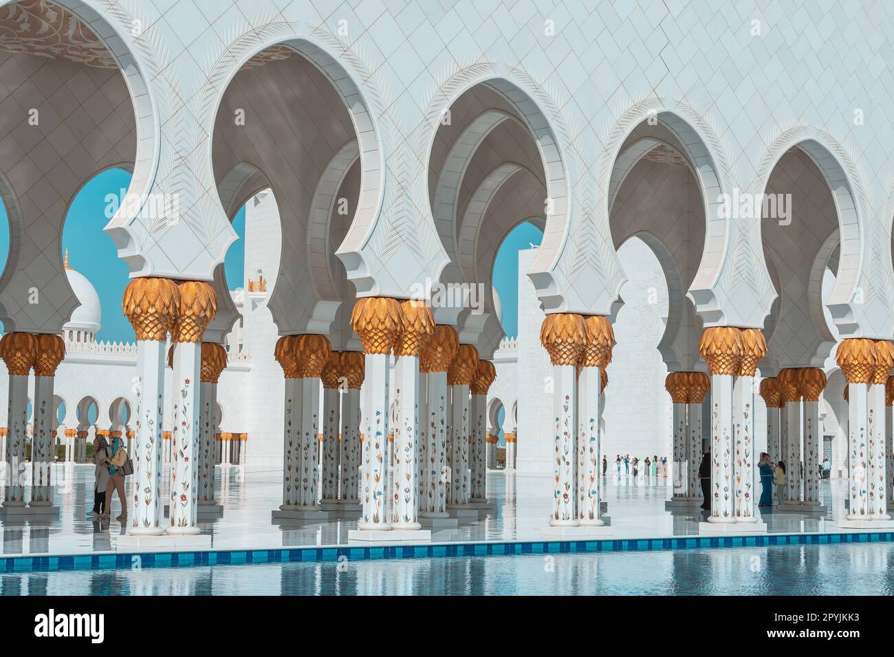 15 January 2023, Abu Dhabi, UAE: Majestic arches tower over a tranquil ...