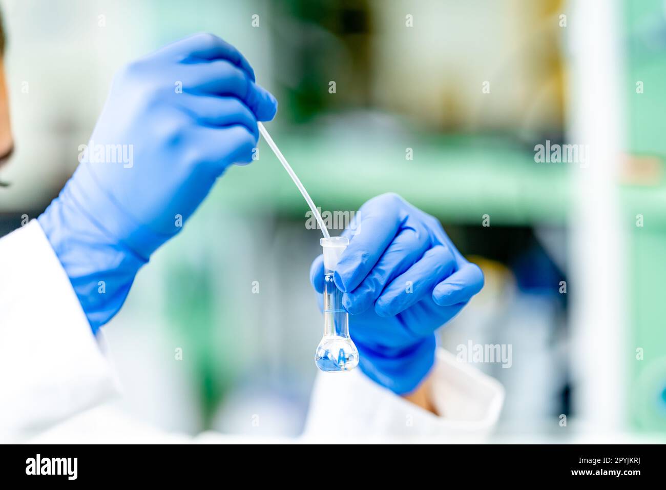 biochemical test in the laboratory. a substance in a glass test tube ...
