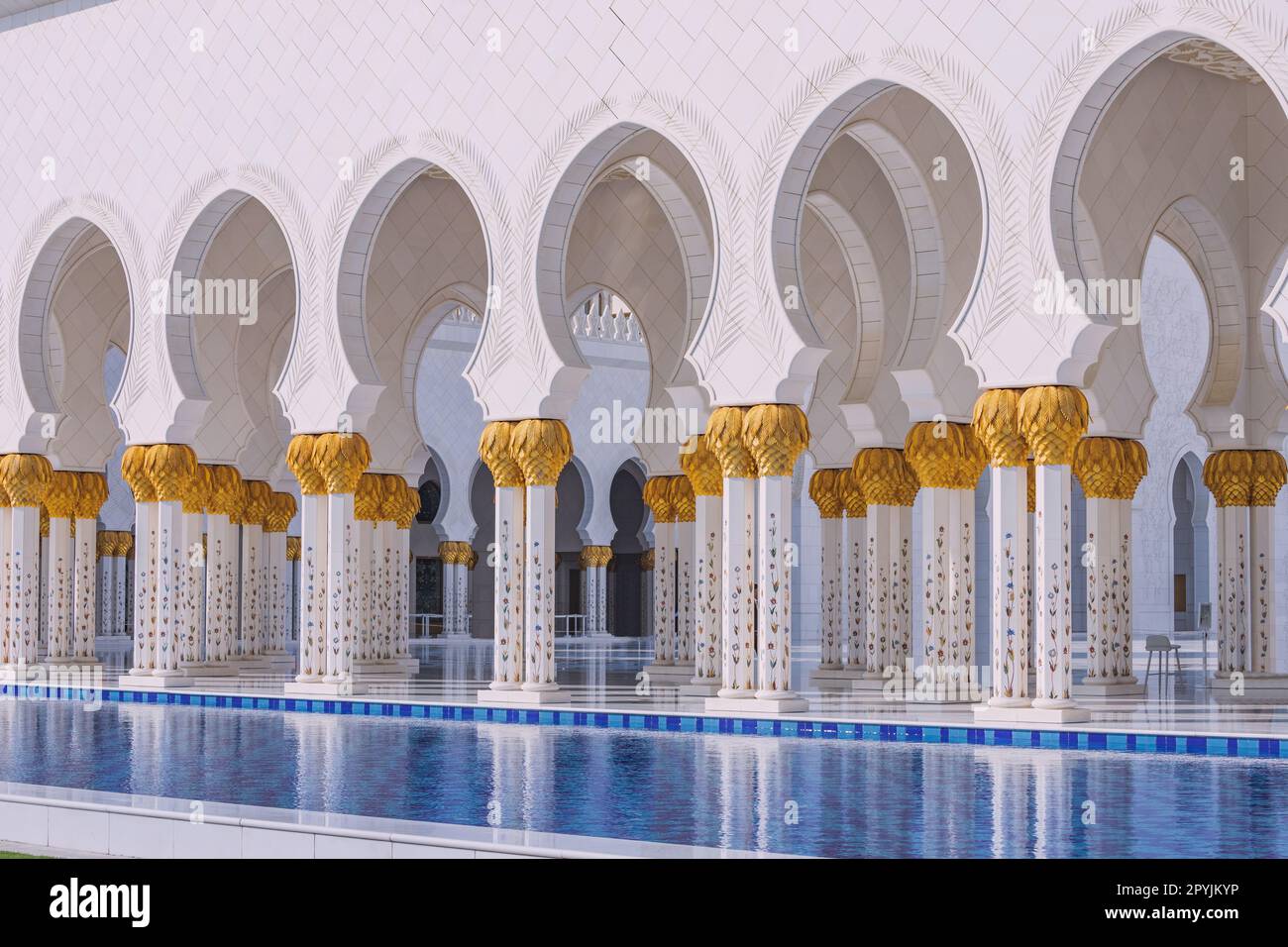 Majestic arches tower over a tranquil pool in the stunning Sheikh Zayed ...