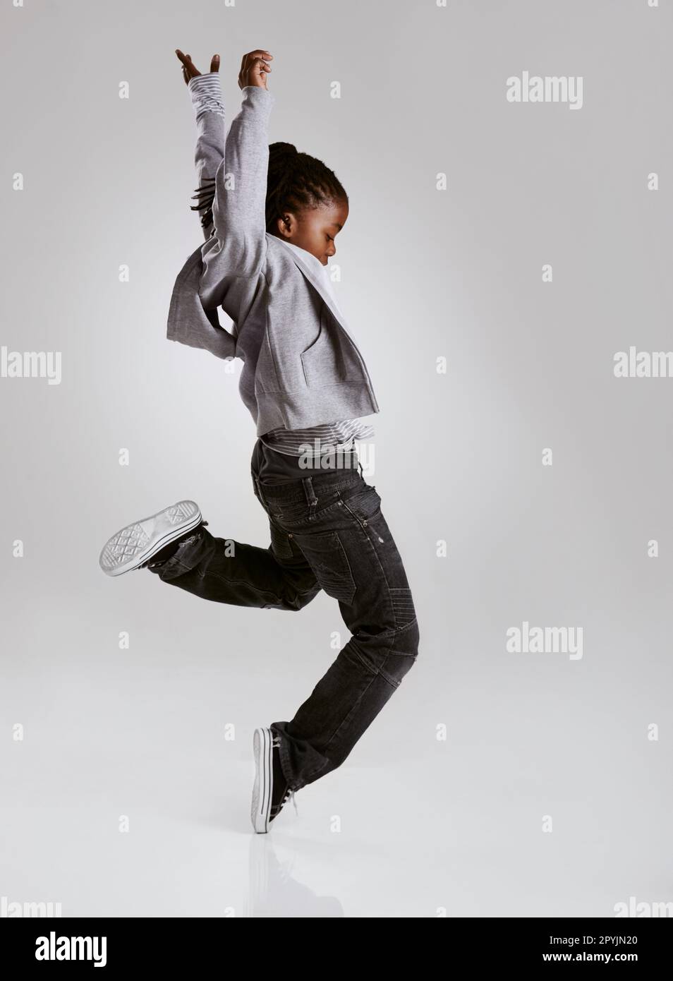 Talent, hip hop and young boy dancer dancing isolated in a white studio ...