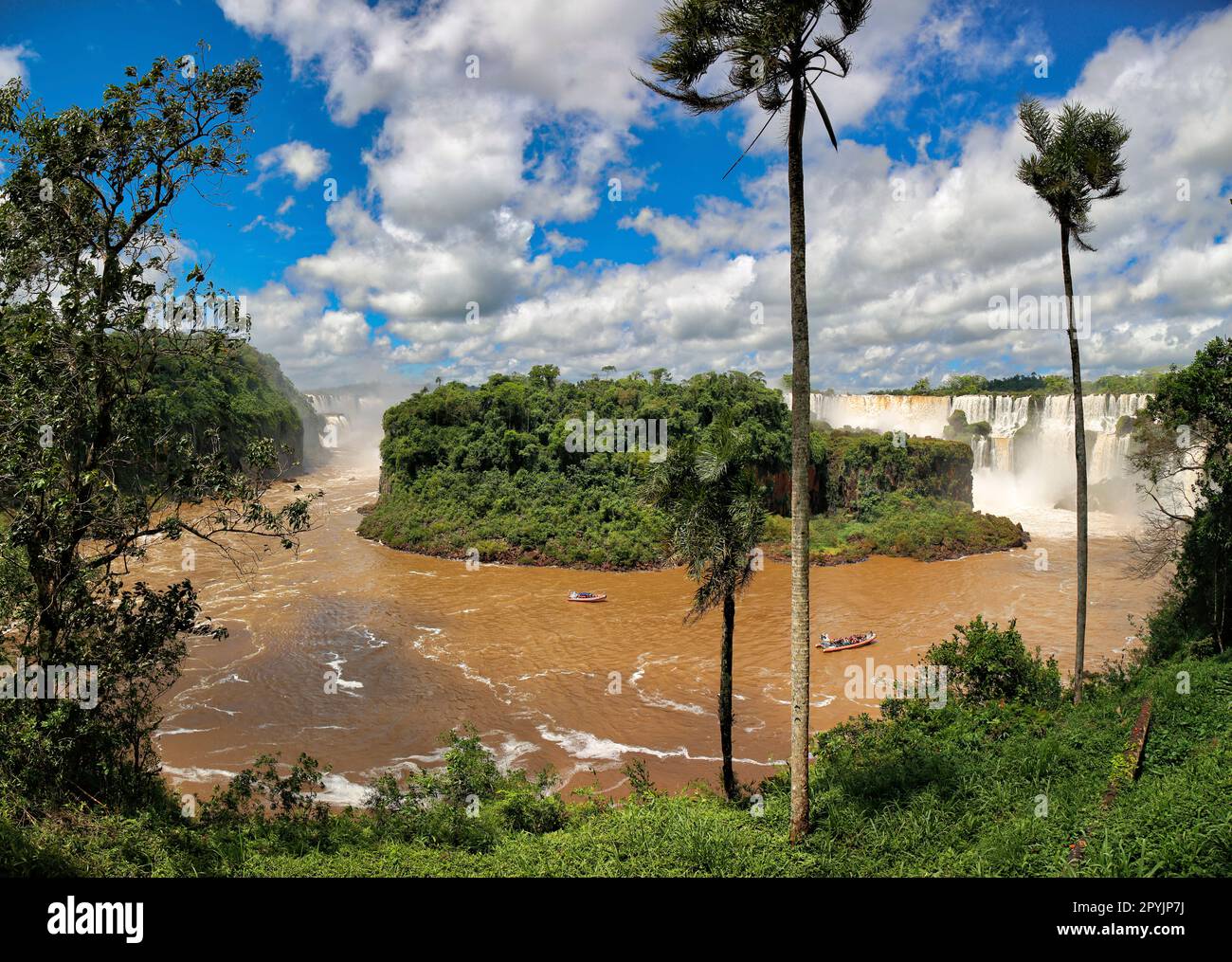 View to Isla San Martin with brown river and falls in background, blue ...