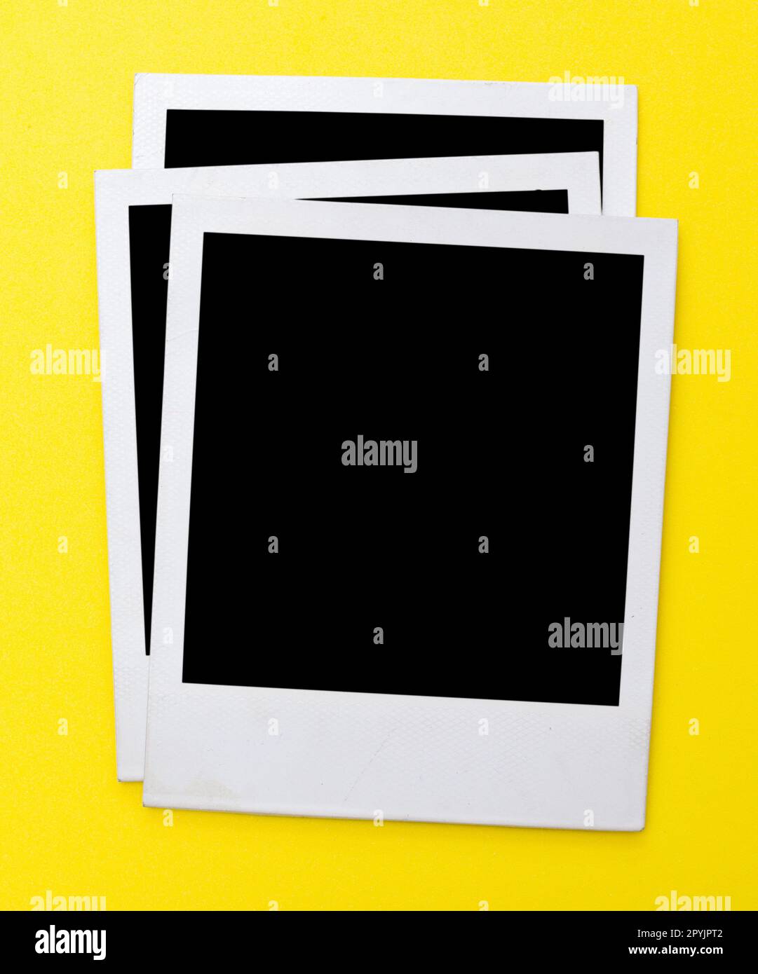 Polaroid photo frames on yellow background Stock Photo - Alamy