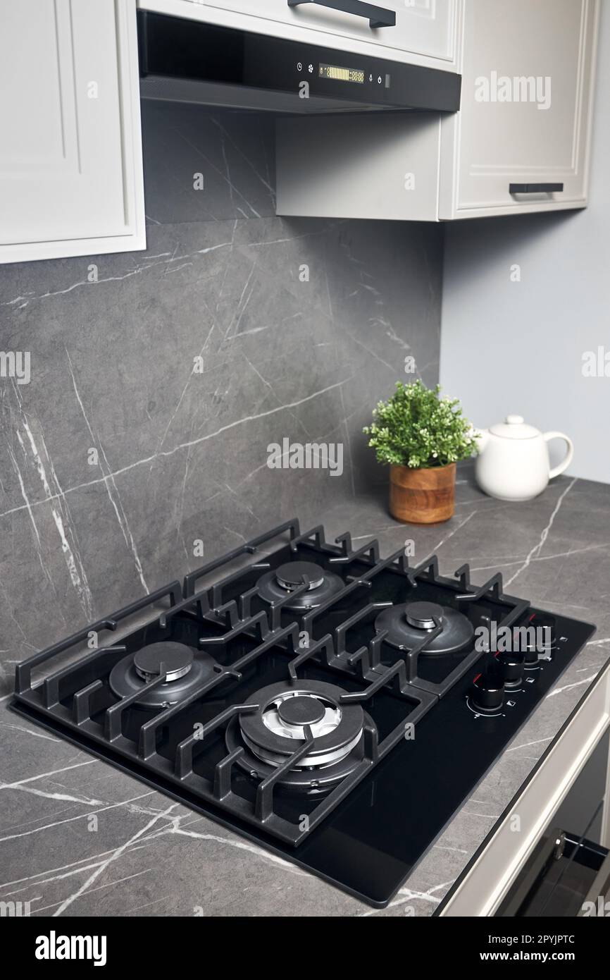 Contemporary black tempered glass gas stove hob with four burners with ...