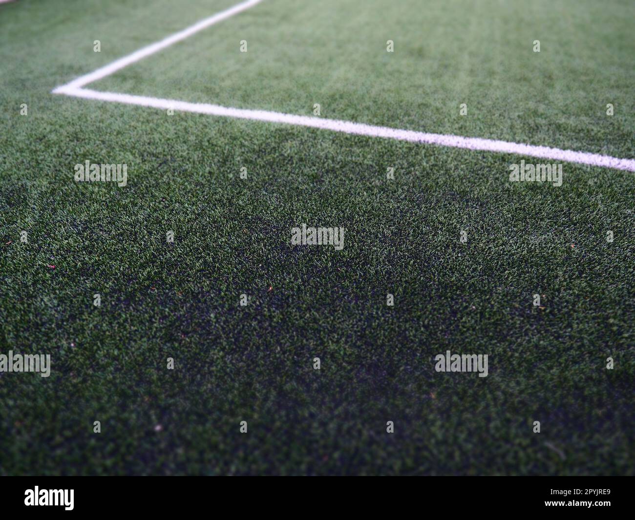 The marking of the football field on the green grass. White lines no ...