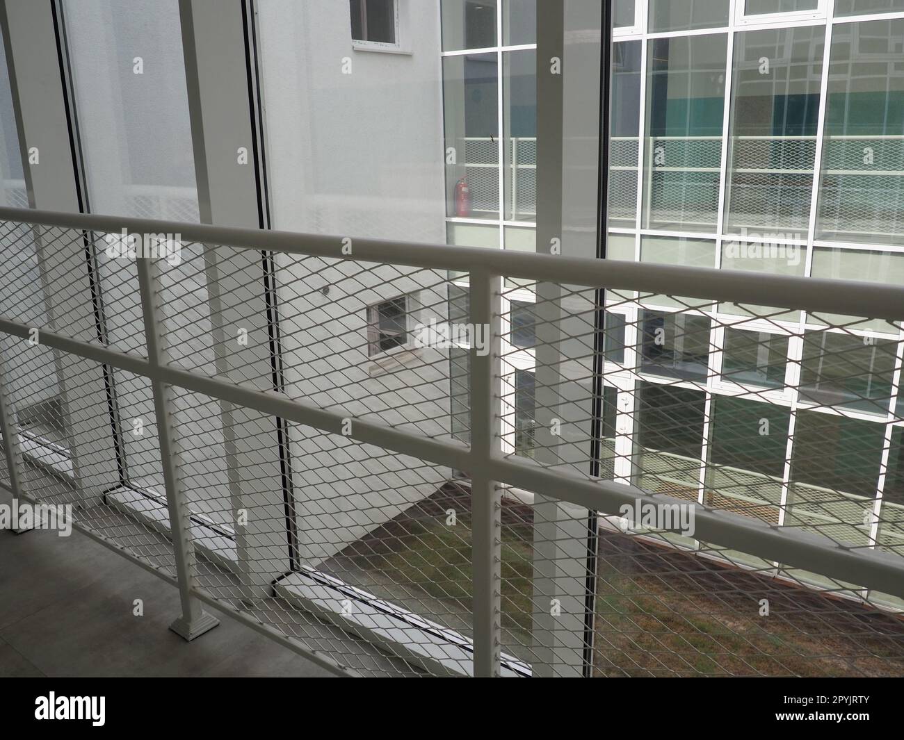 New white frames and windows. Metal fence for the safety of ...