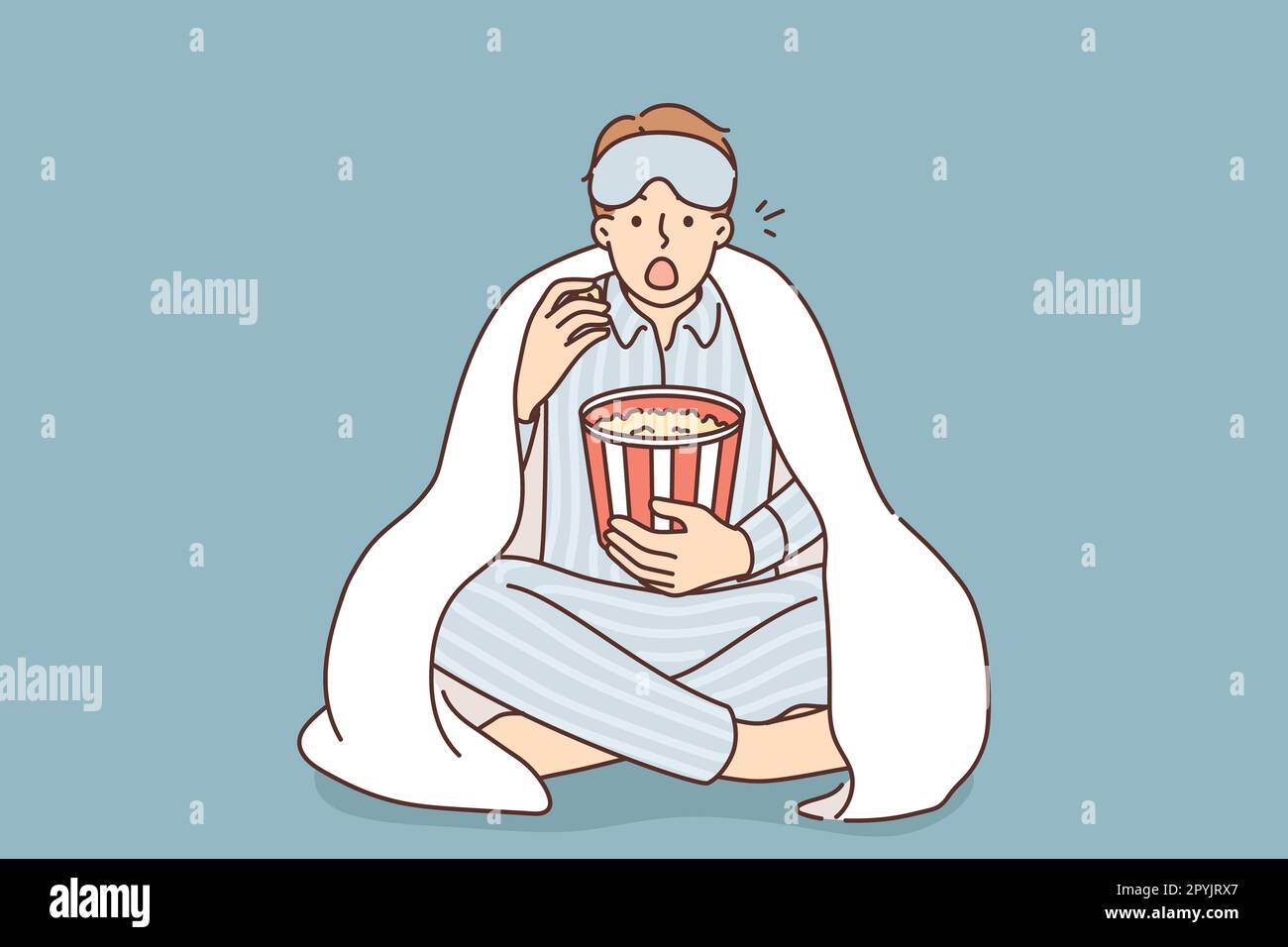 Man in pyjama under blanket eat popcorn watch movie at home. Surprised ...
