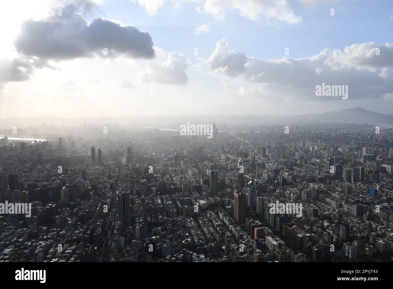 Aerial view of a beautiful city from the roof of Taipei 101 on a cloudy ...