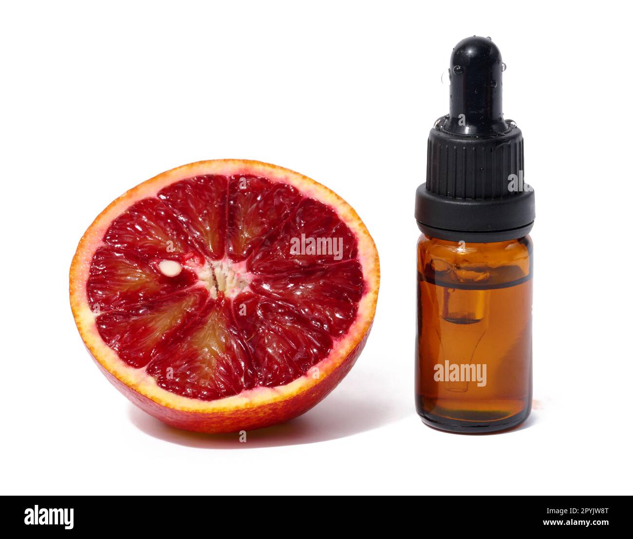 Brown glass bottle with a pipette and half of a red orange on a white ...