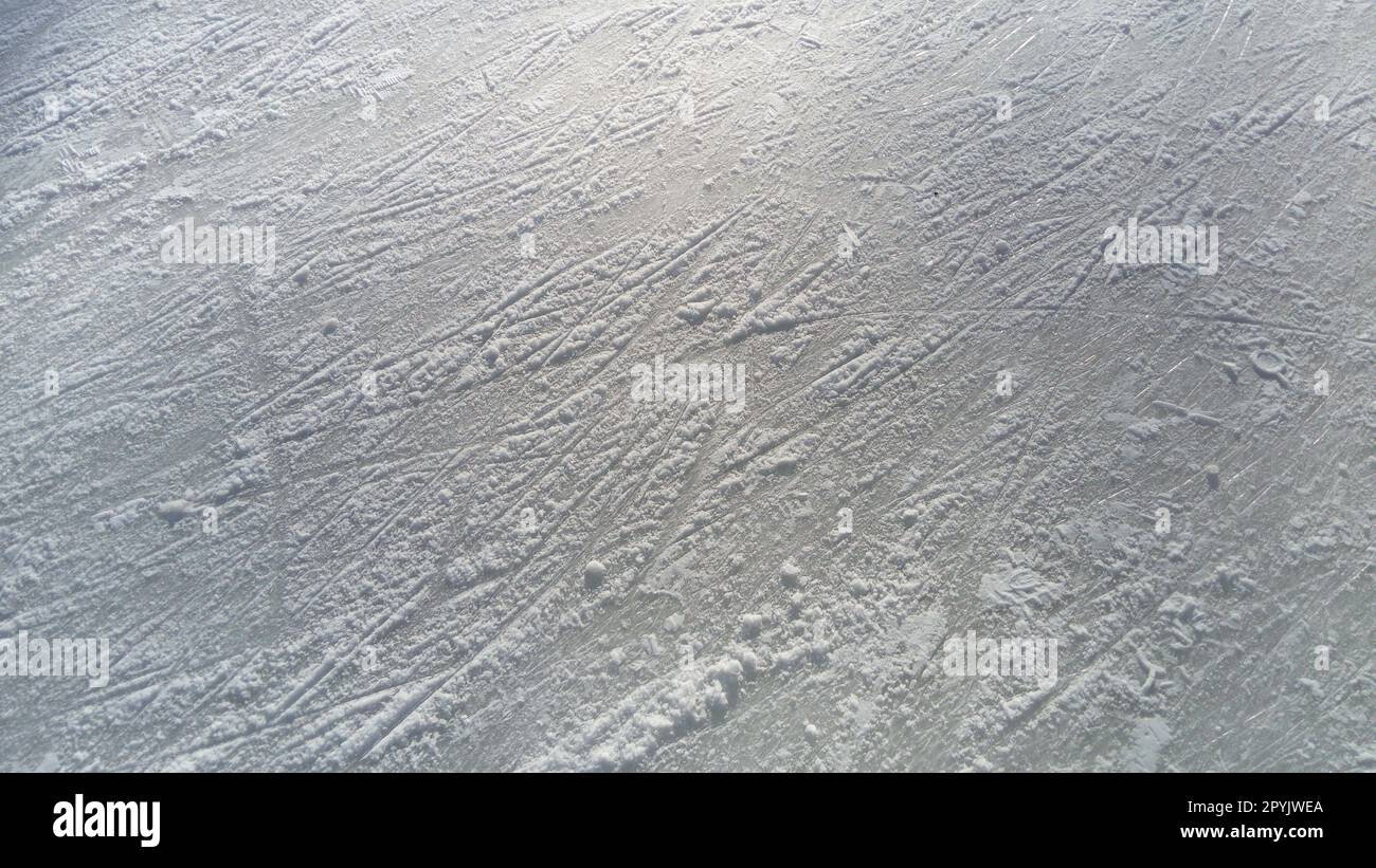 Ice streaked with the tip of figure skates. Figure skating on ice. The ...