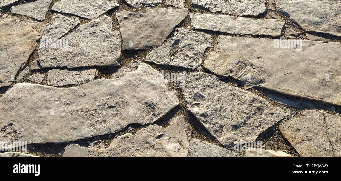 The pavement of the large flat stones in the center of the old town ...