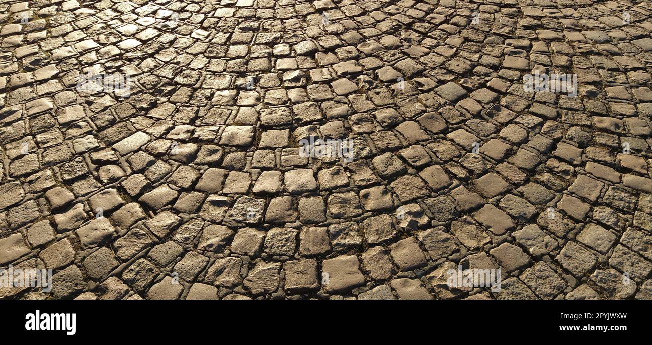 Ancient pavement. Sidewalk made of gray stones. Cobblestones on the ...