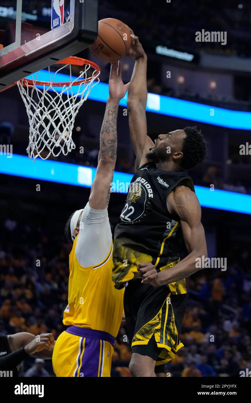 Golden State Warriors forward Andrew Wiggins (22) dunks against Los Angeles Lakers forward ...