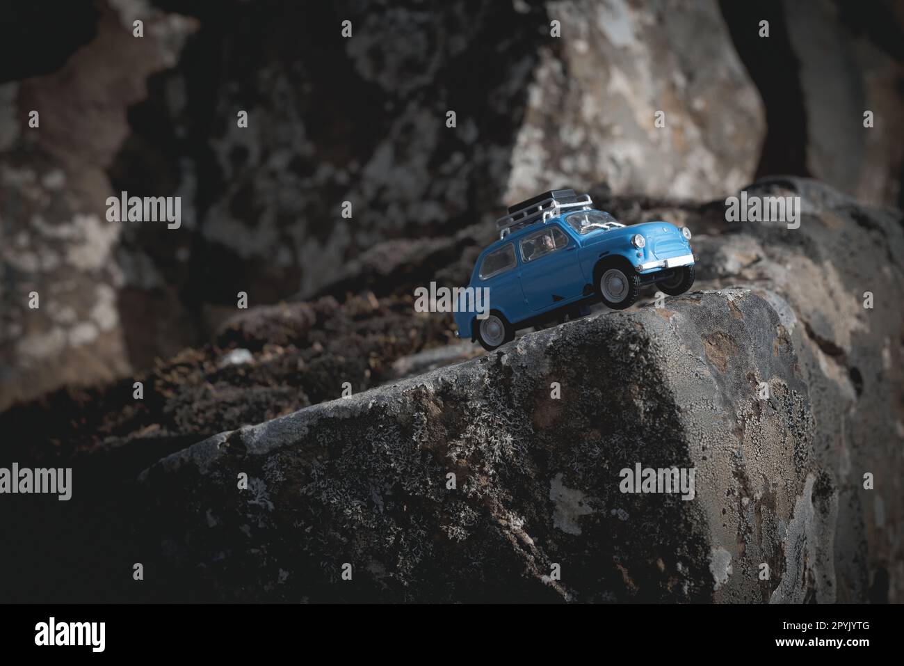 Miniature car goes an extreme mountain Stock Photo - Alamy
