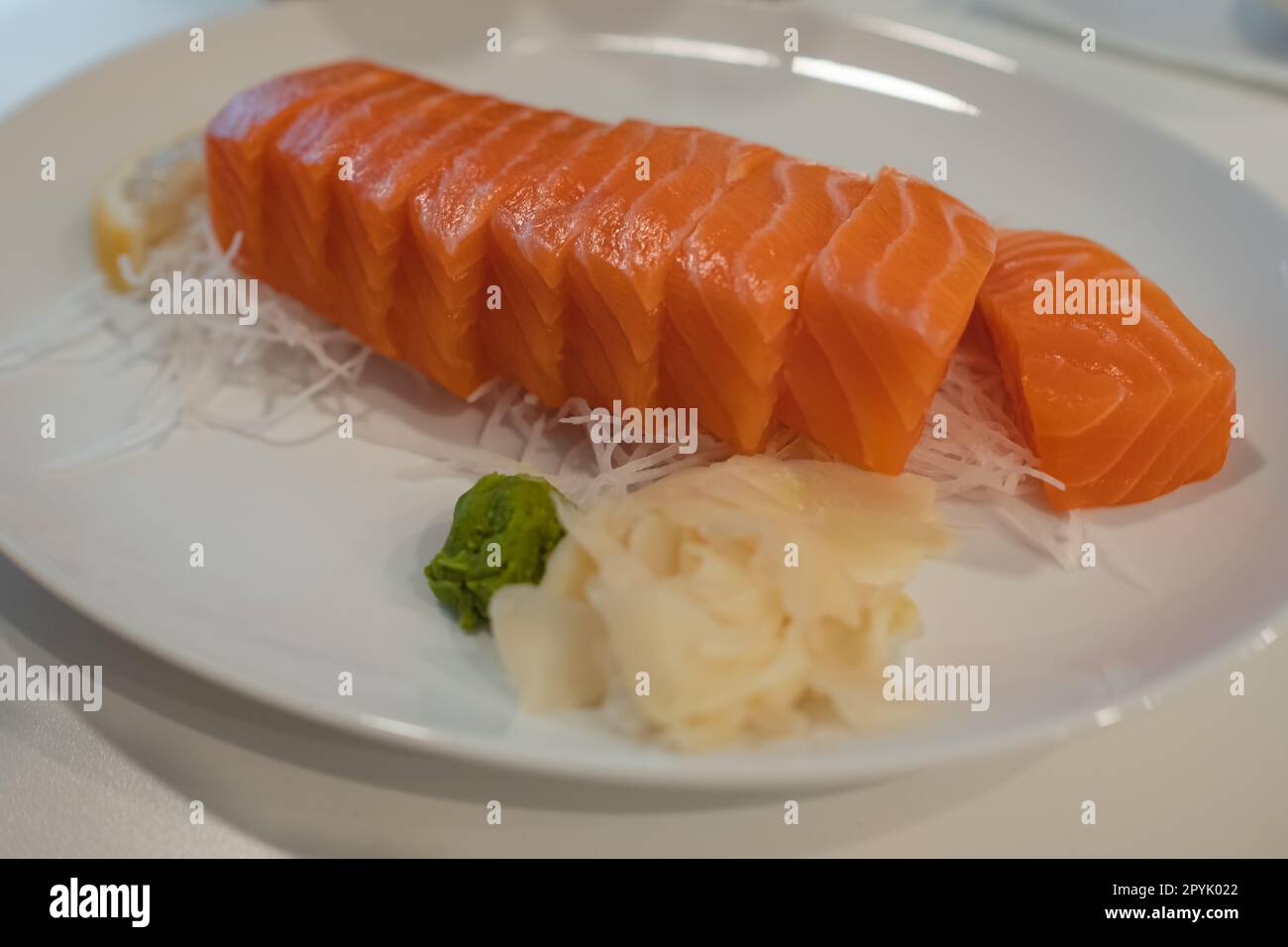 Salmon Sashimi fish Japanese food. Salmon raw sashimi on white plate. Famous Japanese salmon ...