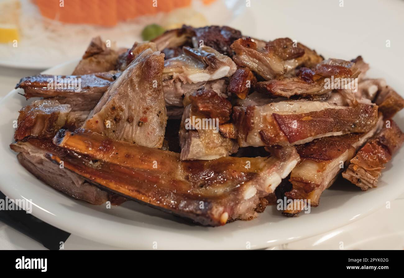 Grilled ribs on a plate. Restaurant menu, dieting. Hot Meat Dishes ...