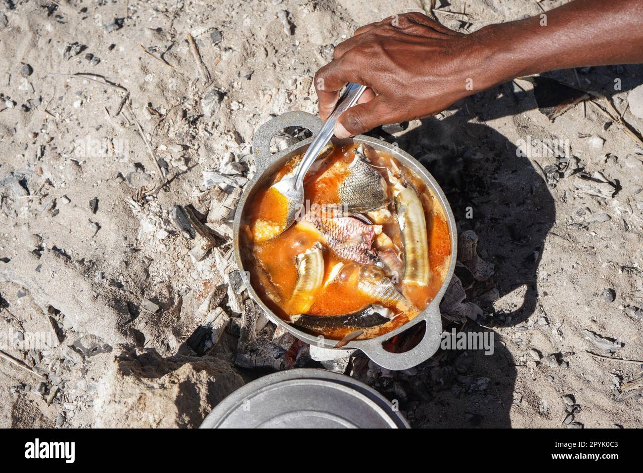 Fish soup or stew cooked from freshly catch seafood in aluminium pot ...
