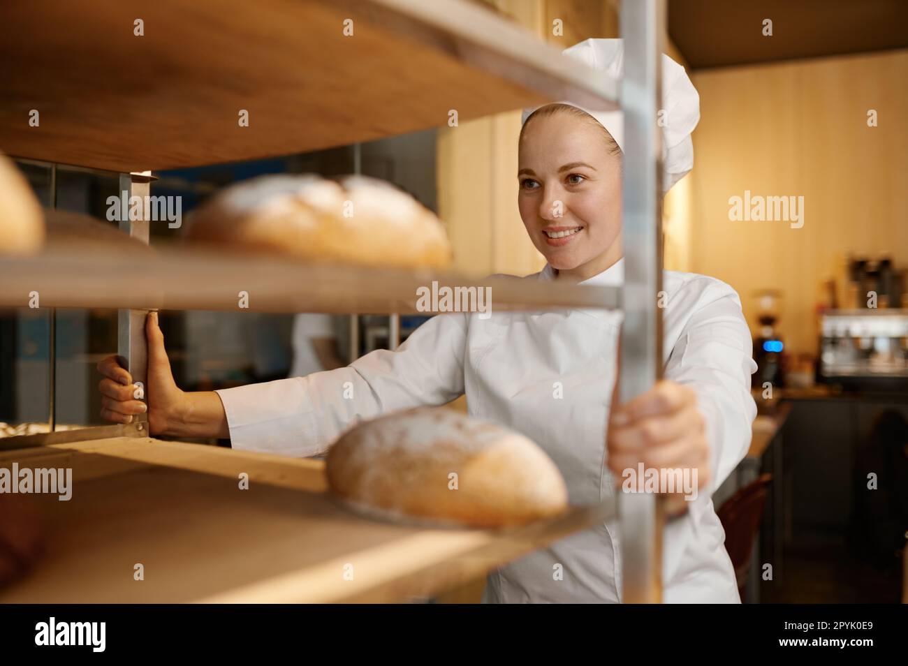 Confident female chef baking bread hi-res stock photography and images ...