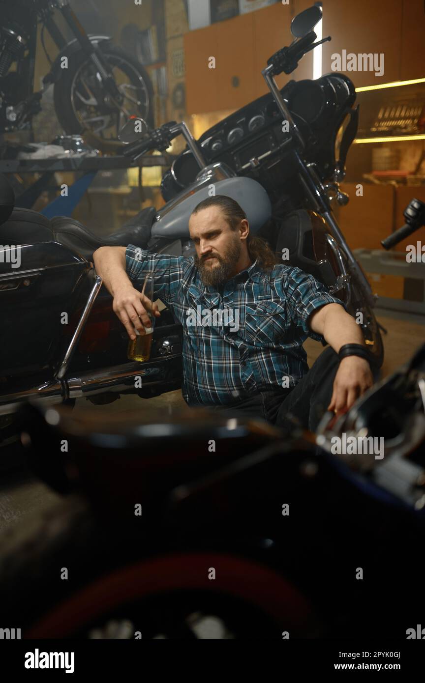 Thinking biker hi-res stock photography and images - Alamy