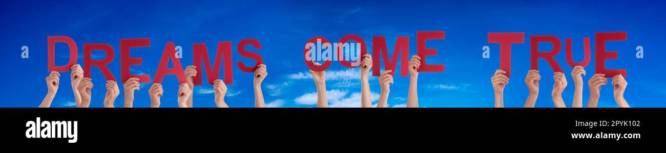 People Hands Building Word Dreams Come True, Blue Sky Stock Photo - Alamy