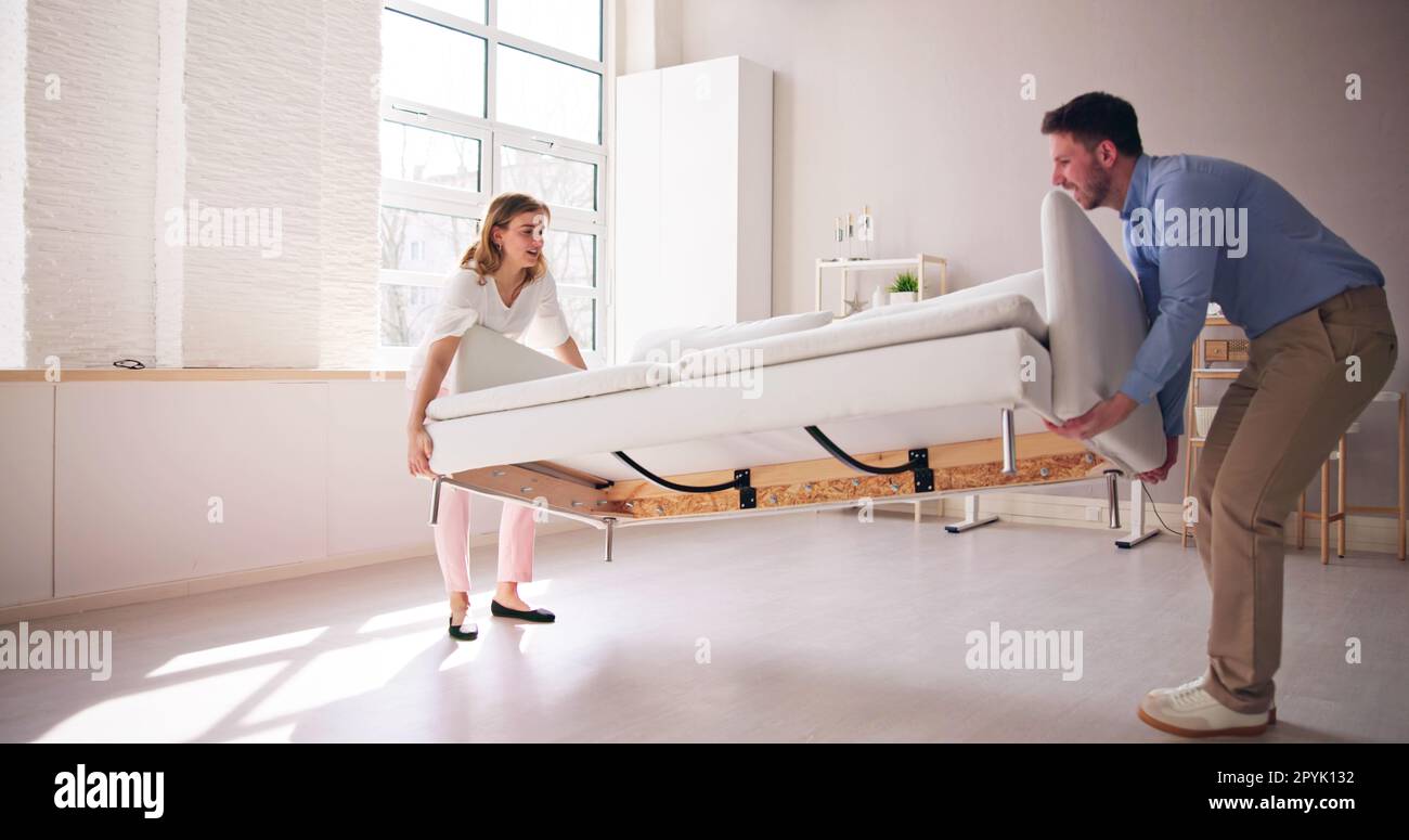 Young couple carrying couch hi-res stock photography and images - Alamy