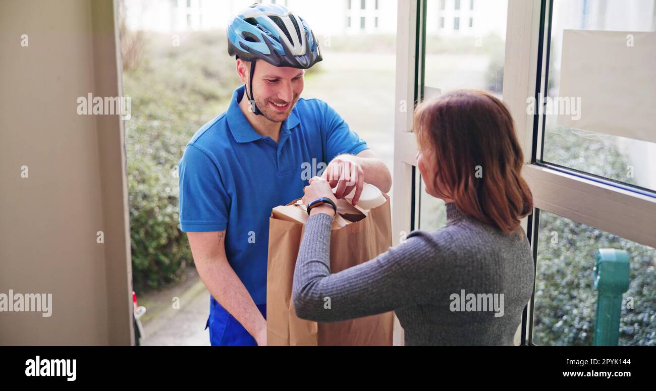Food delivery man giving hi-res stock photography and images - Alamy