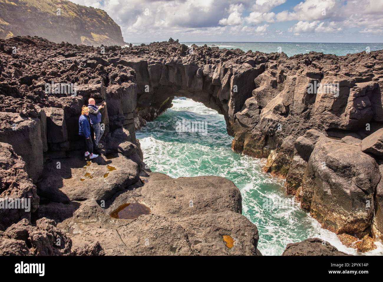Portugal, Azores, Sao Miguel Island, Ponta da Ferraria. Couple taking ...