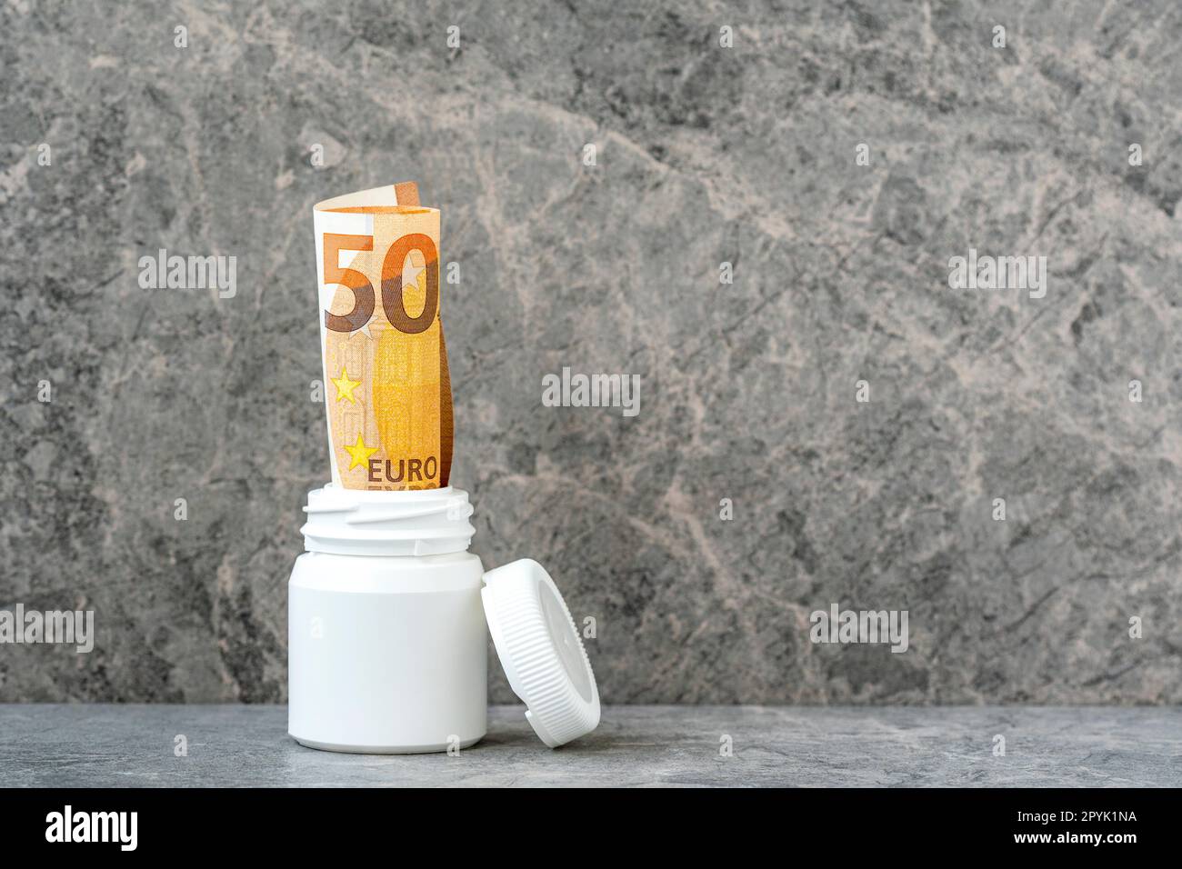 Fifty euro banknote rolled in the medical bottle Stock Photo - Alamy
