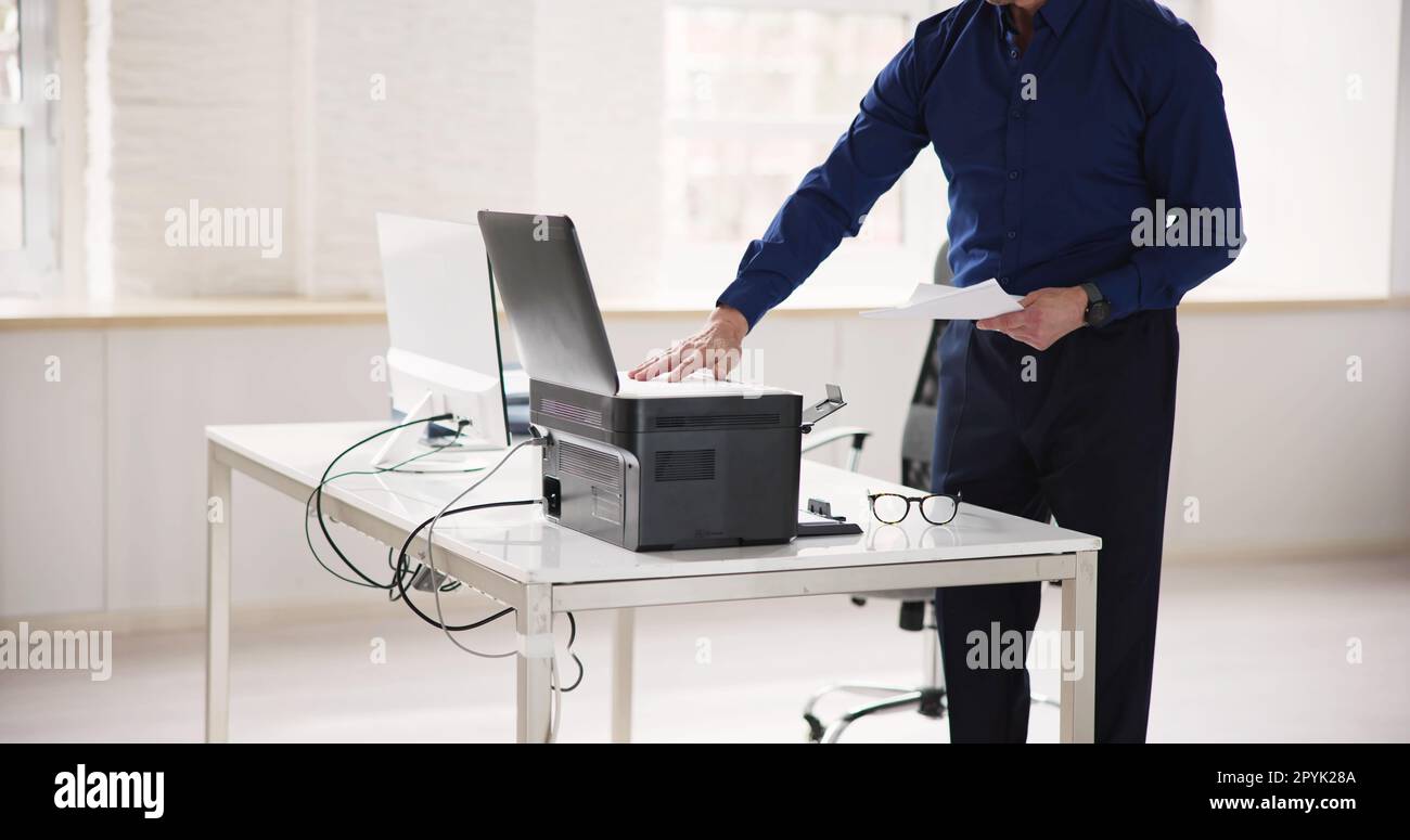 Businessman using fax machine hi-res stock photography and images - Alamy