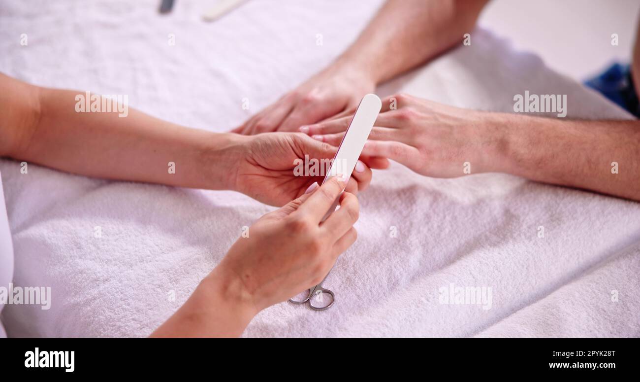Hand man nails manicure hi-res stock photography and images - Alamy