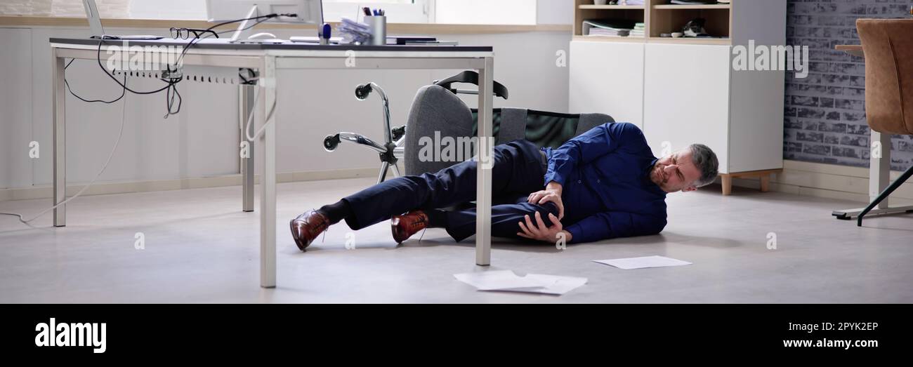 Faint Accident In Office. Fall From Chair Stock Photo - Alamy