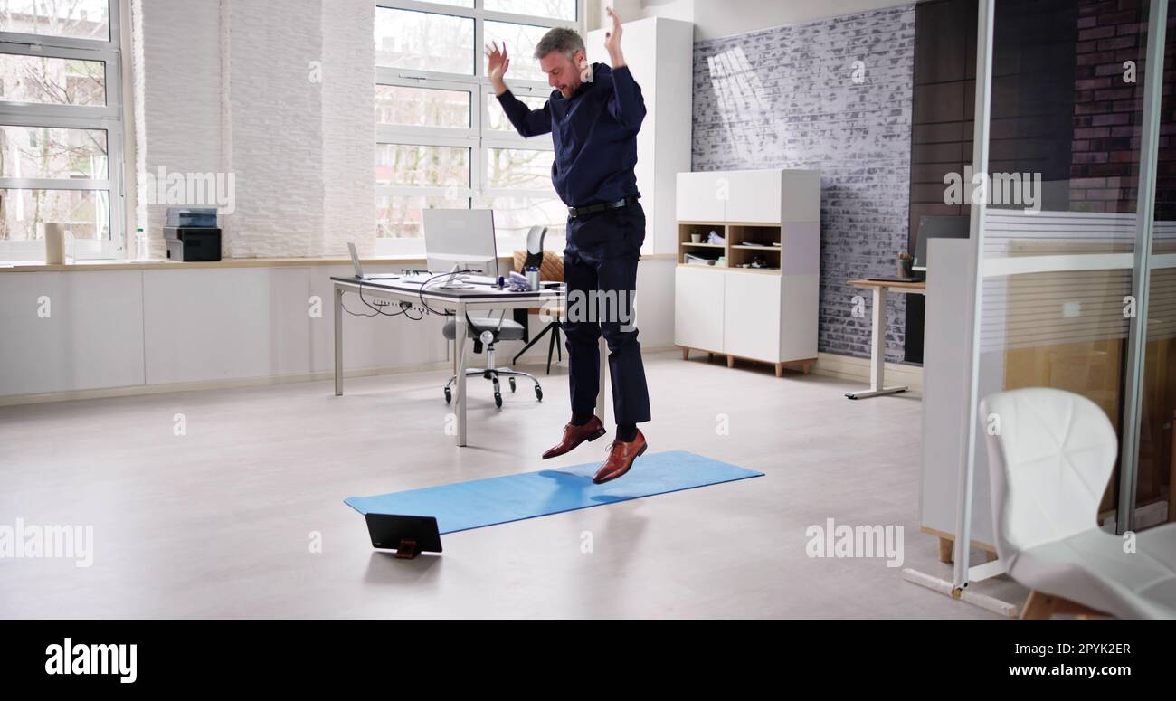 Burpee Training Exercise In Office Stock Photo - Alamy