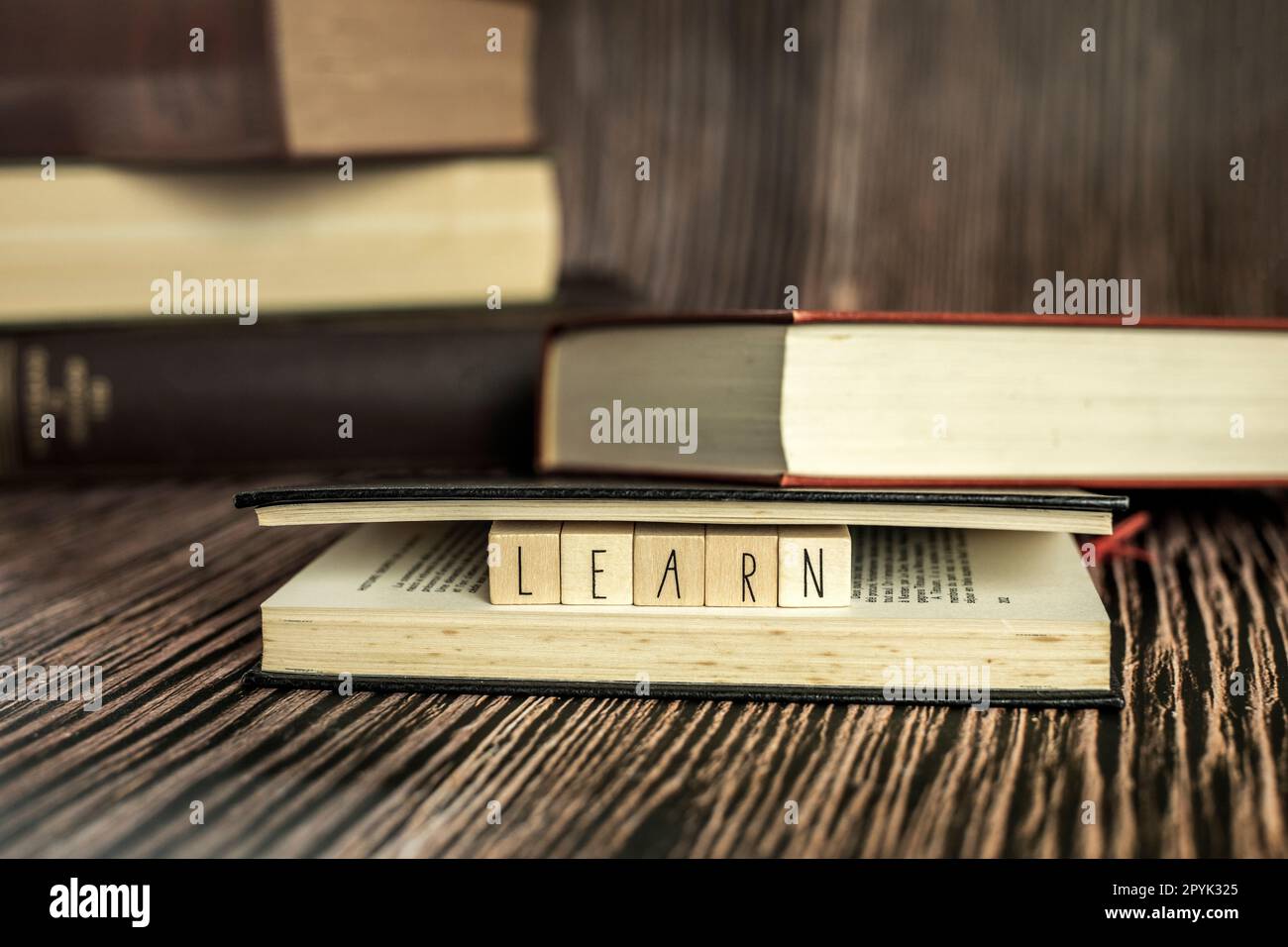 Pile of books, reading. Stack of books in the colored cover lay on the ...