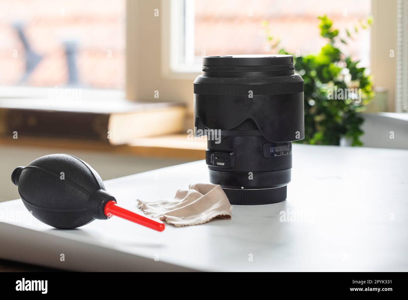 Lens on desk with cleaning tools for DSLR and Mirrorless cameras ...