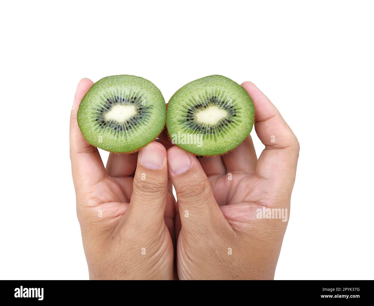 Hand holds sliced half of kiwi fruit isolated on white background Stock ...
