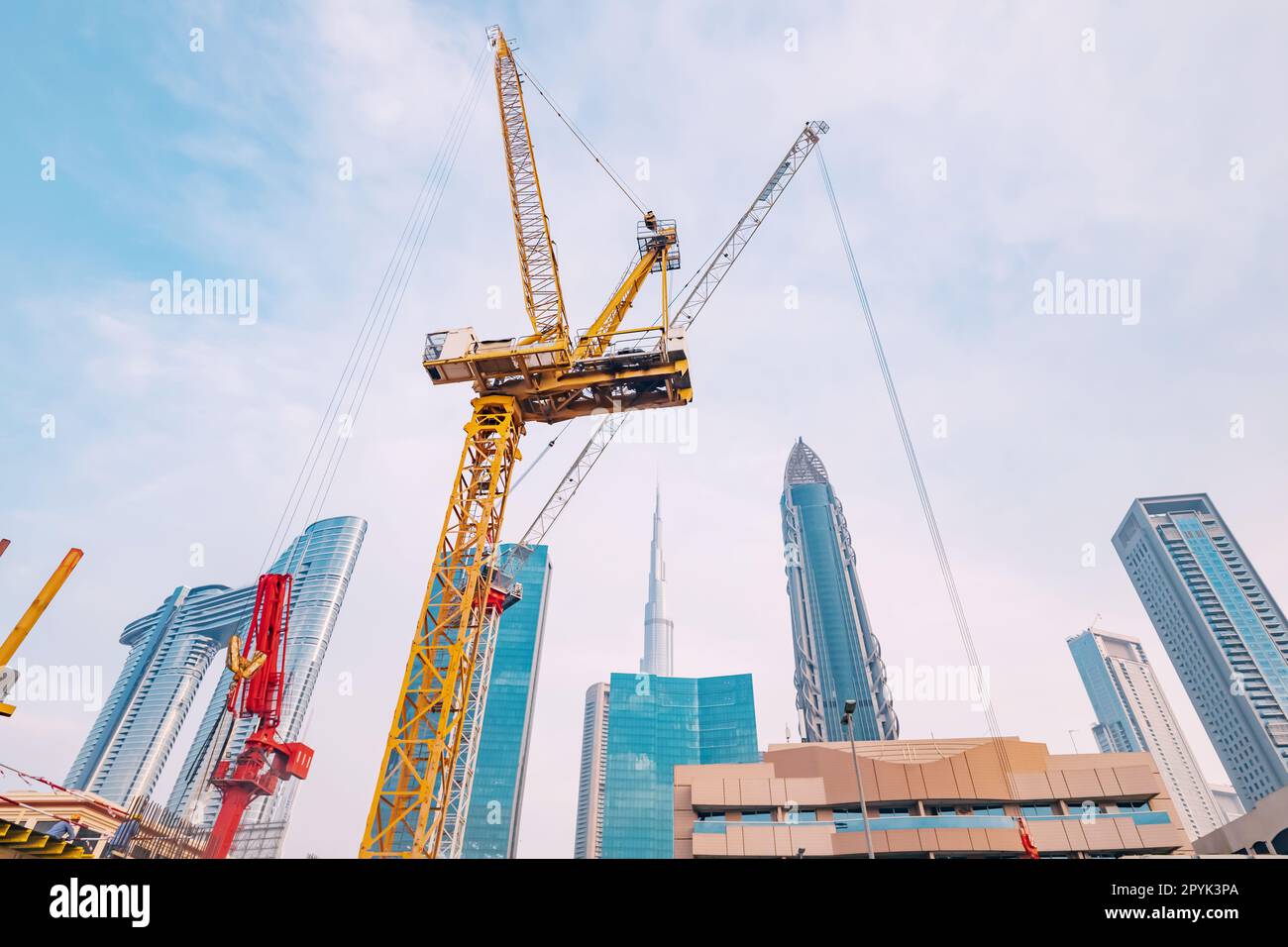 construction site with crane machinery against background with Dubai ...